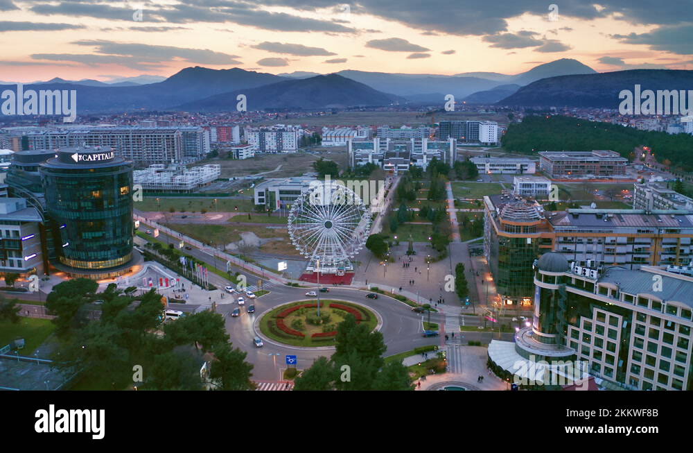 Sunset sky over sustainable eco city planned with green urbanism in ...