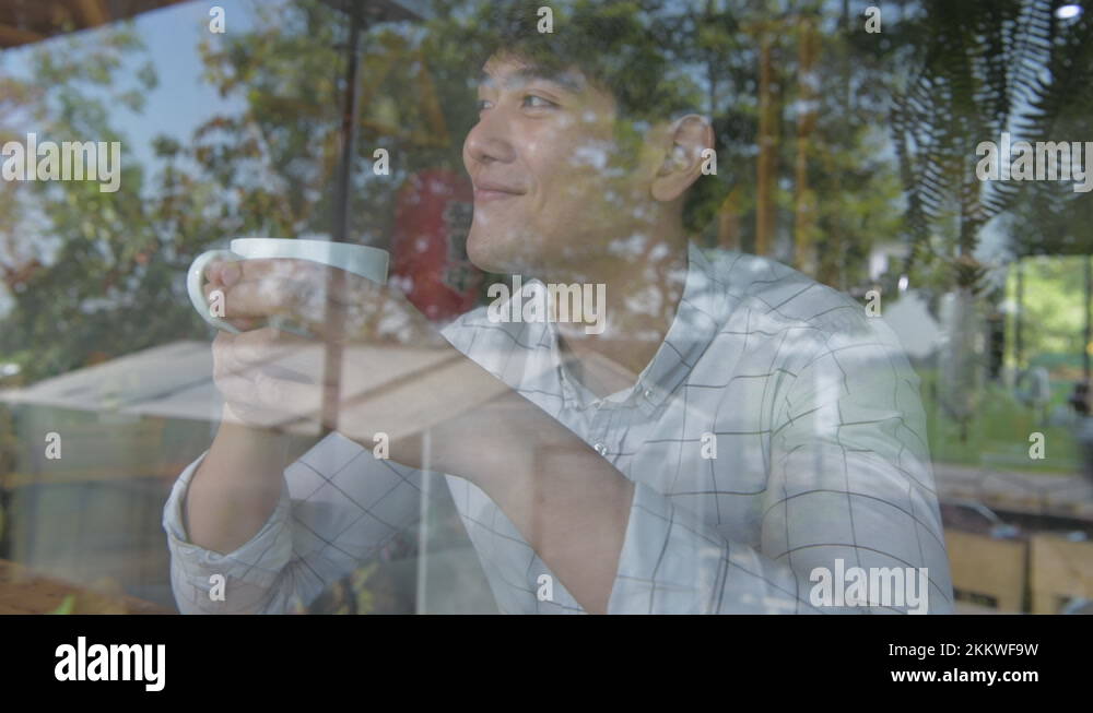 Coffee shop concept of 4k Resolution. Asian men are enjoying coffee in ...