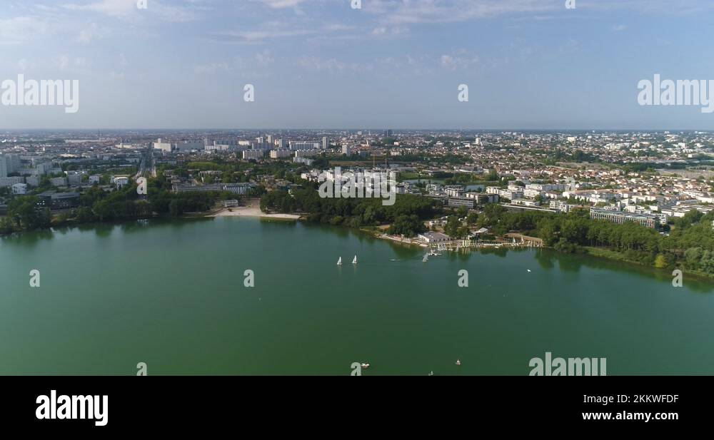 Bordeaux Sailboat center on the Le Lac lake shore with city behind ...