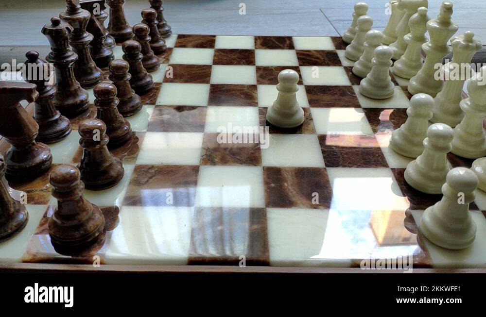 Close up at eye sight of marble chess game. It's bright and the board ...