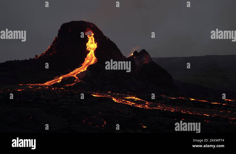 Volcanic eruption Iceland 2021 lava cone river gushing flow Stock Video ...