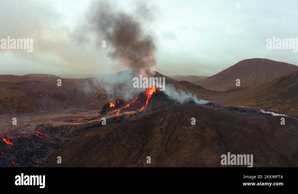 Hazardous sulfur dioxide smoke and gas, rising from a volcano crater ...