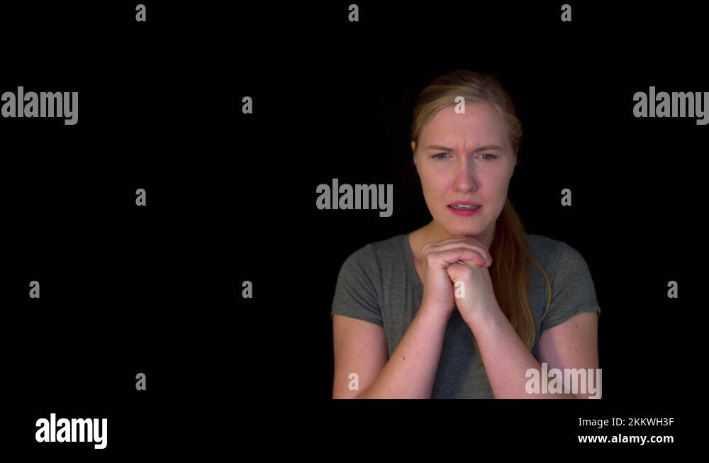 Scared woman praying. Worried and afraid woman prayer, desperate ...