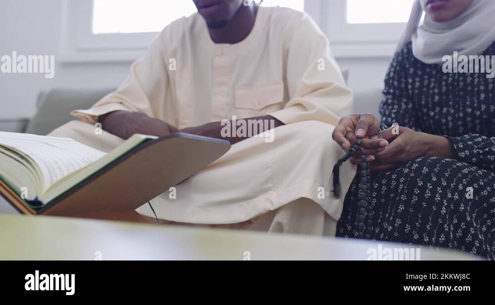 African muslim couple at home in ramadan reading quran holly islam book ...