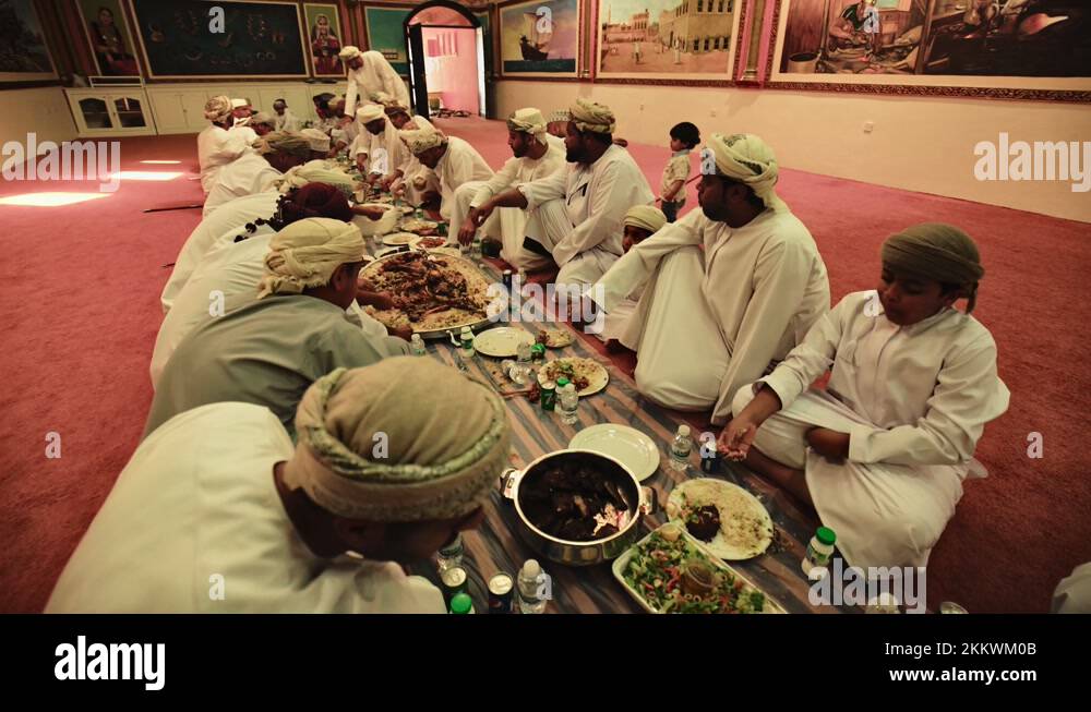 Omani Men eating in traditional Oman Banquet buffet dinner - Wide pull ...