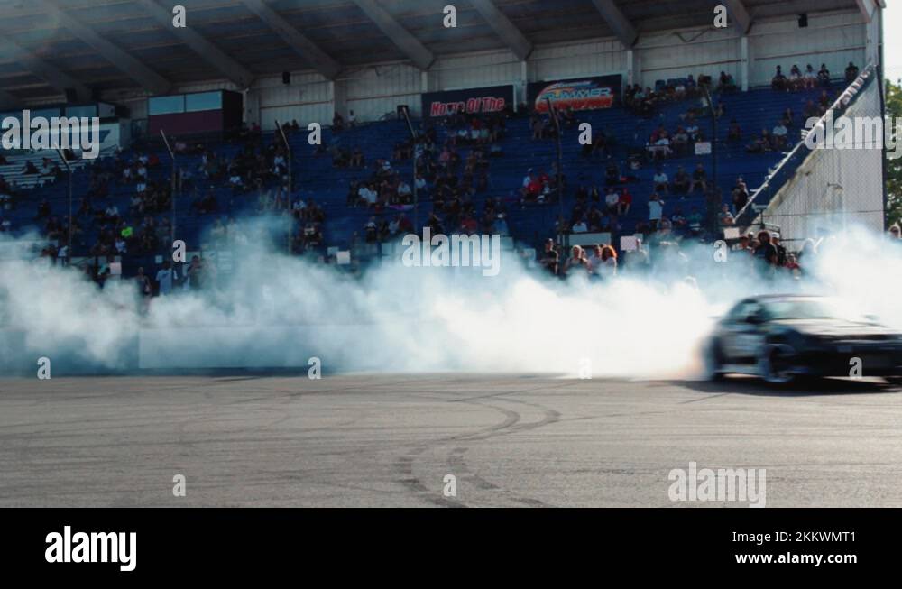 Fast Cars Drifting Past Camera Leaving Clouds of Smoke in their Wake ...