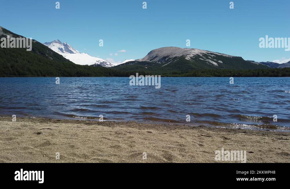 Coarse sand beach, deep blue water and clear mountain air in Laguna ...