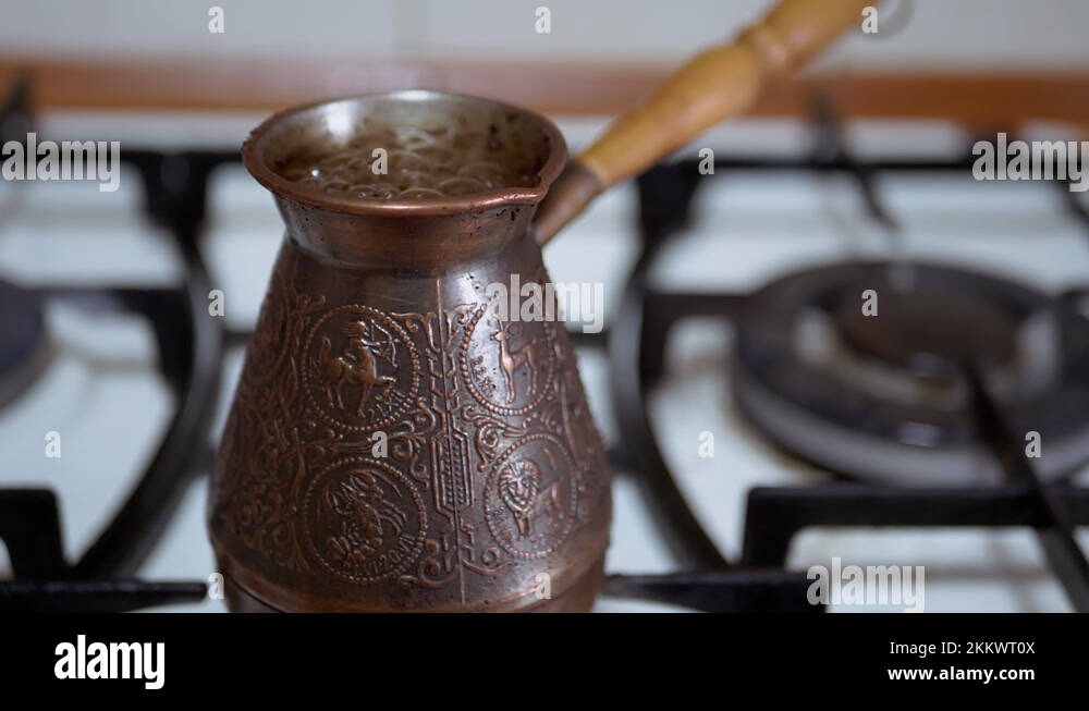 Brewing Ground Turkish Coffee in a Copper Turk on a Gas Stove. Slow ...