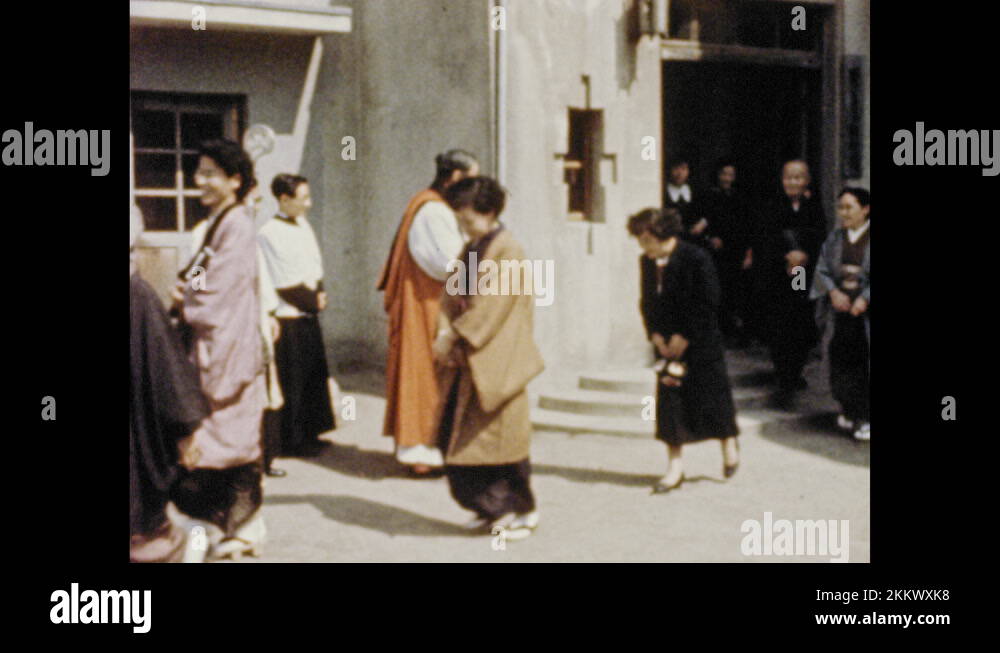 1950s: Congregation leaves church. Priest bows to people. Sign. Bishop ...