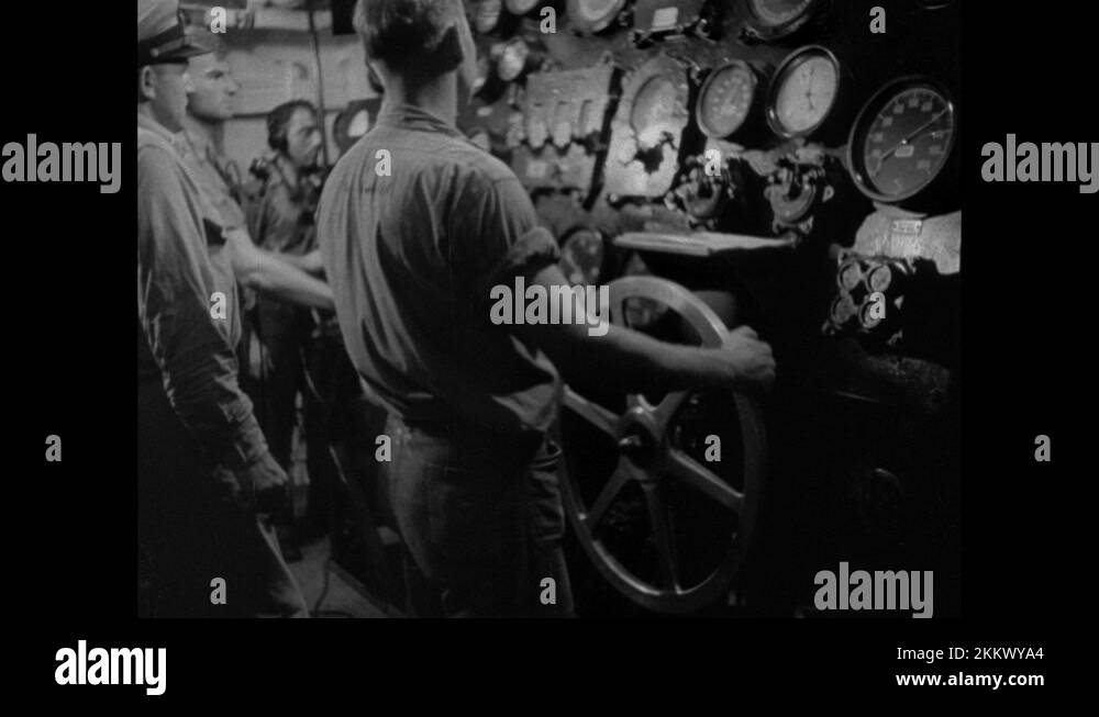 1940s: Silhouette of men on ship. Front of ship in water. Sailors at ...