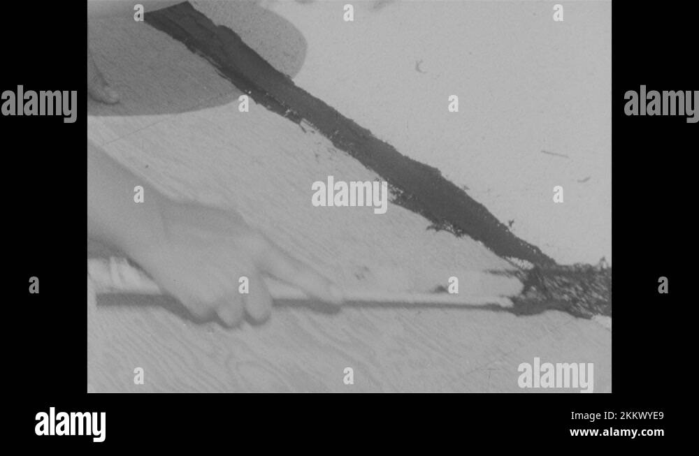 1960s: Sticks take tar from can. Hand spreads tar with stick. People ...