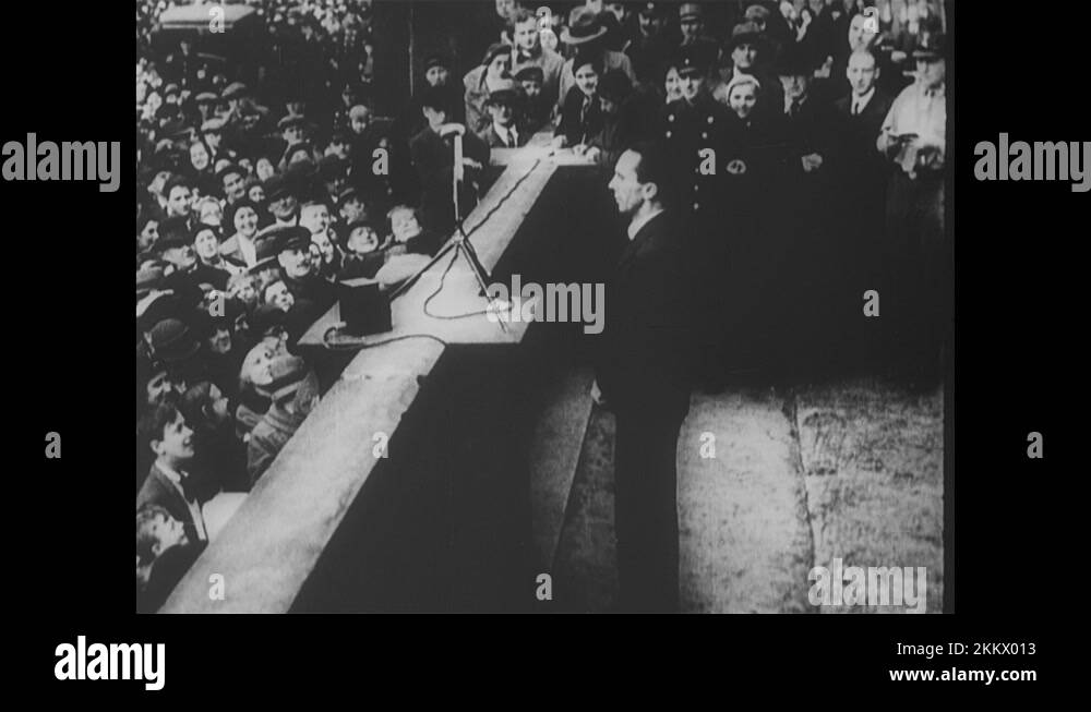 1930s Germany: Crowd raises arms and cheers. Joseph Goebbels stands on ...