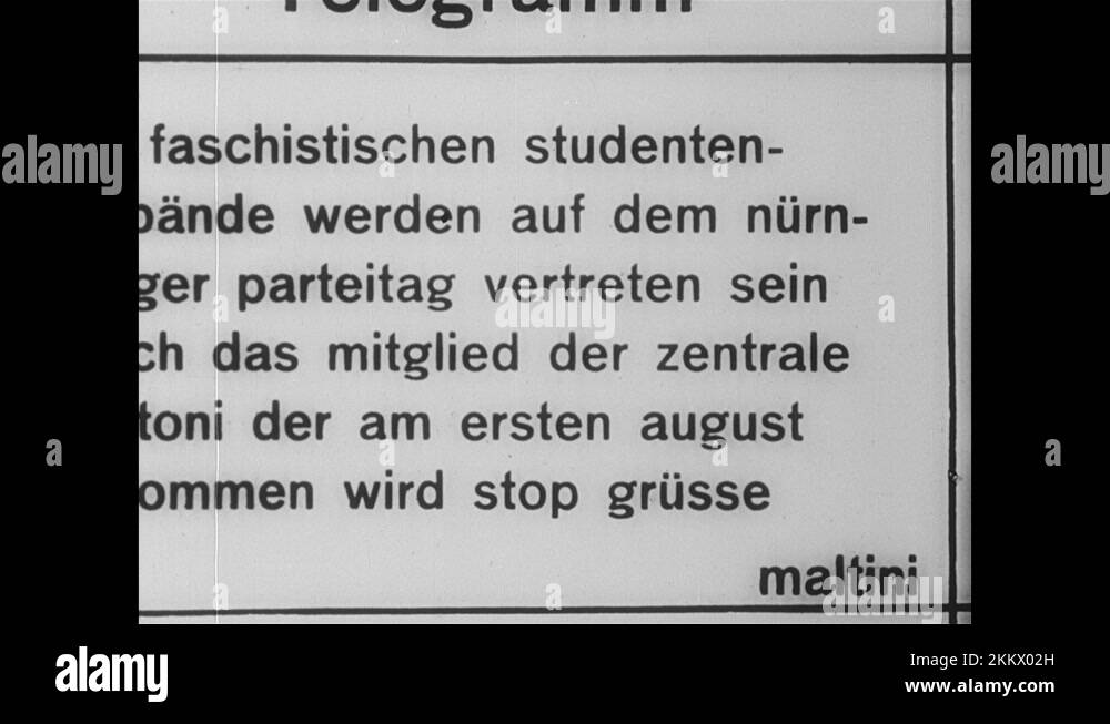1930s Germany: Typed words on telegram. Text placard. Men in suits and ...