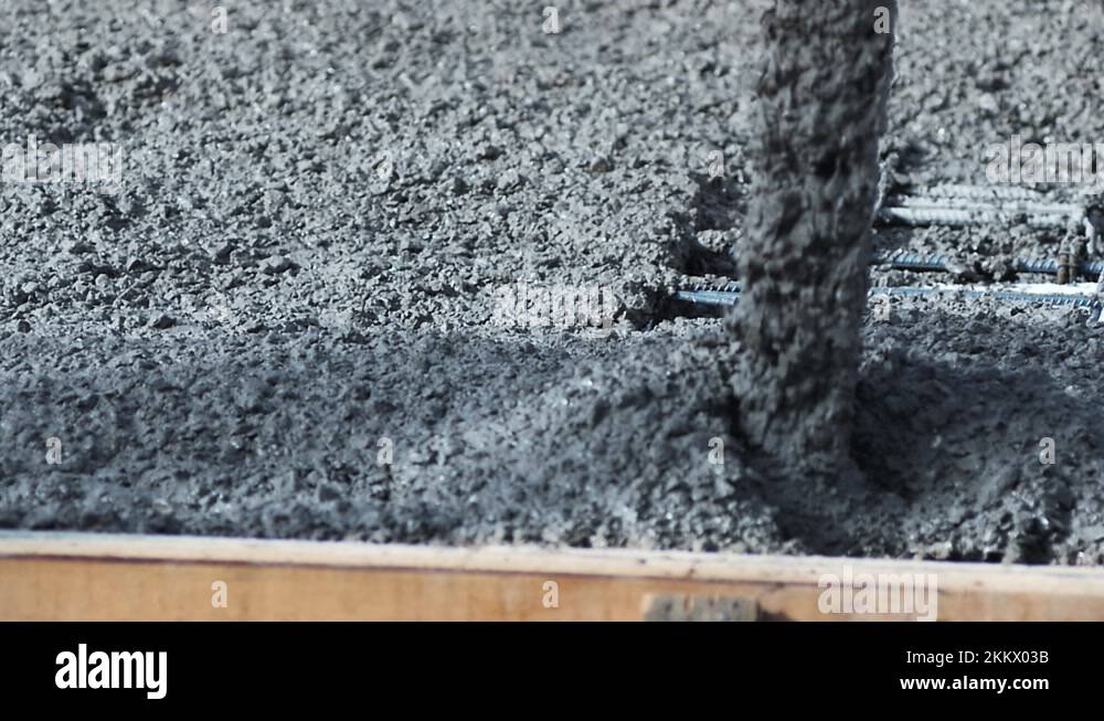 Slow Mo. Concrete mix being pouring on concreting formwork. Forming ...