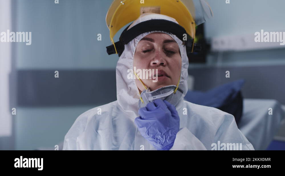 Female doctor taking off mask during break Stock Video Footage - Alamy