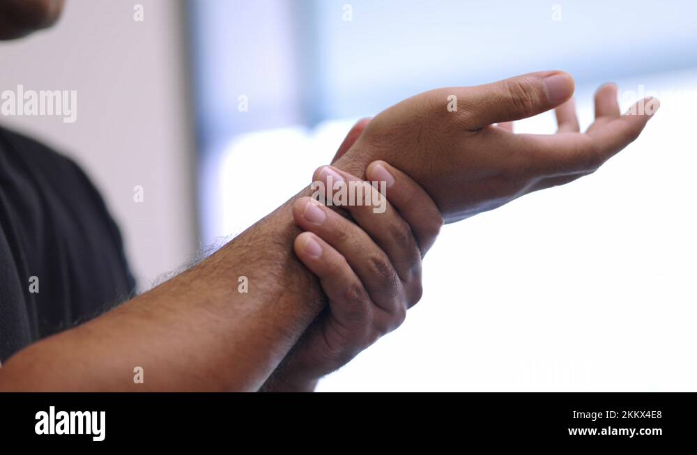 Close up male hand get hurt and pain in hand, wrist. Symptom office ...