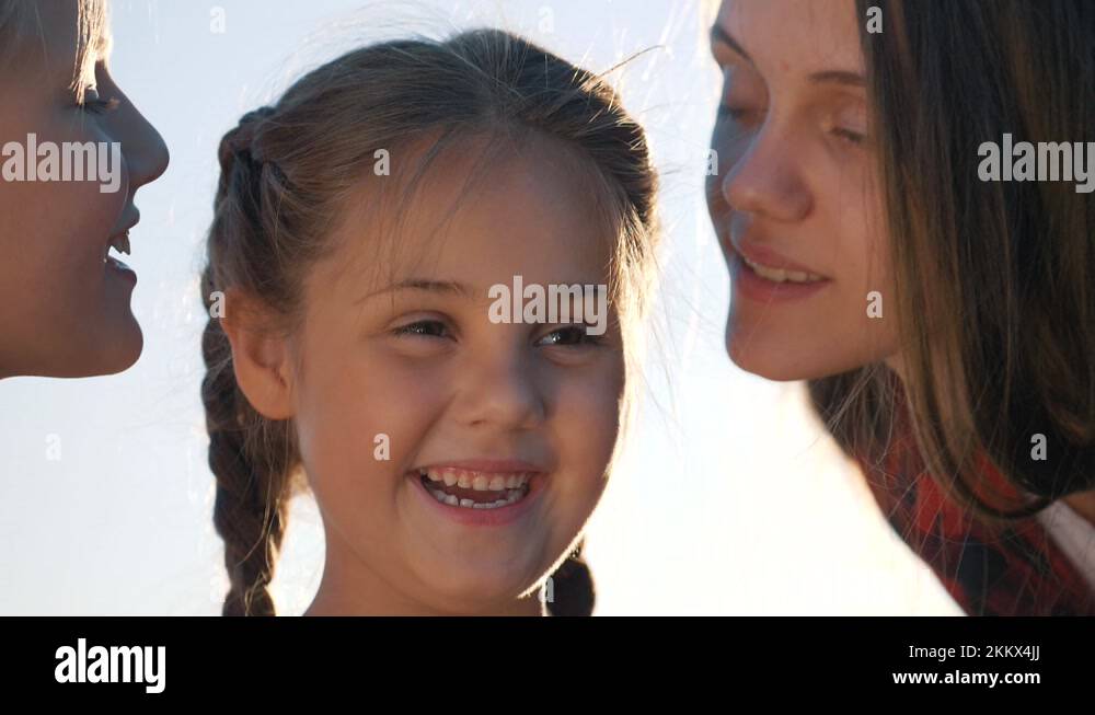 Happy children, family concept. older sisters play with their younger ...