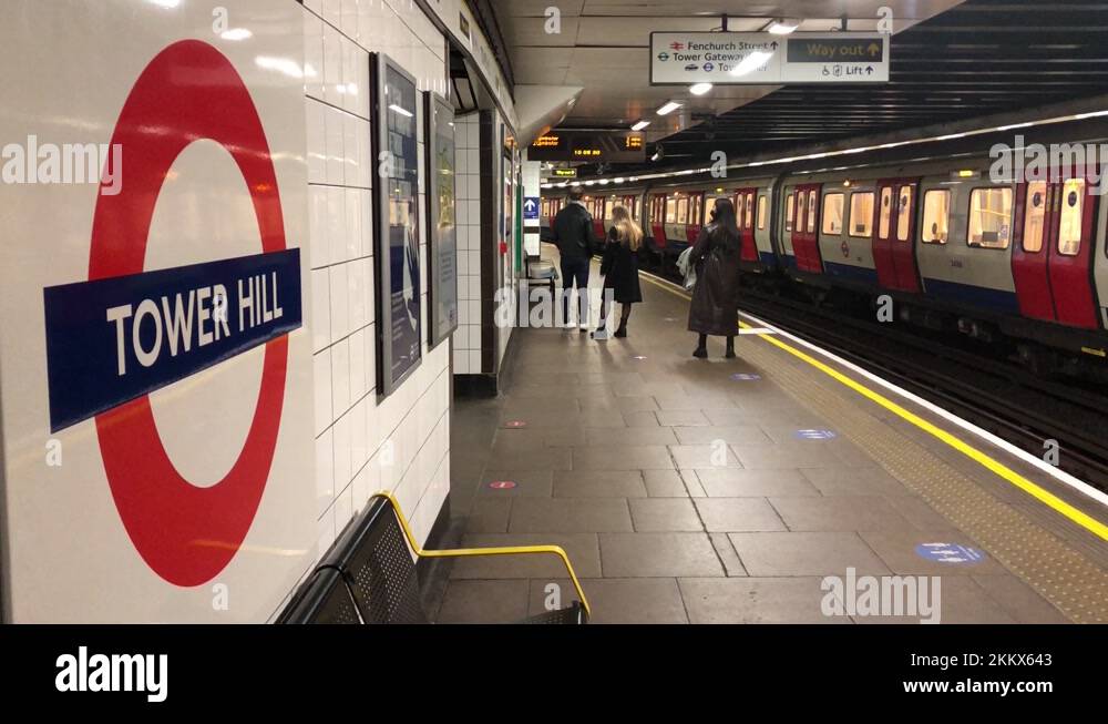 People stand on platform in Tower Hill tube station in central London ...