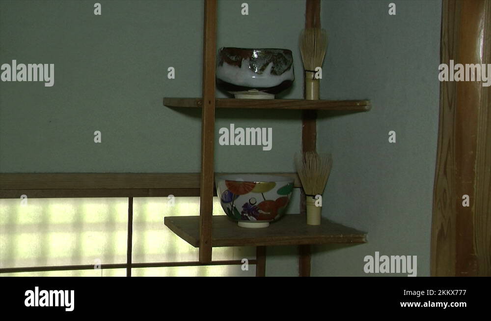 Japanese tea bowls and bamboo whisks on shelves in Japanese tea house ...