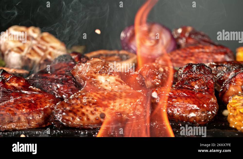 Super Slow Motion Shot of Seasoning Falling on Fresh Grilled Chicken ...