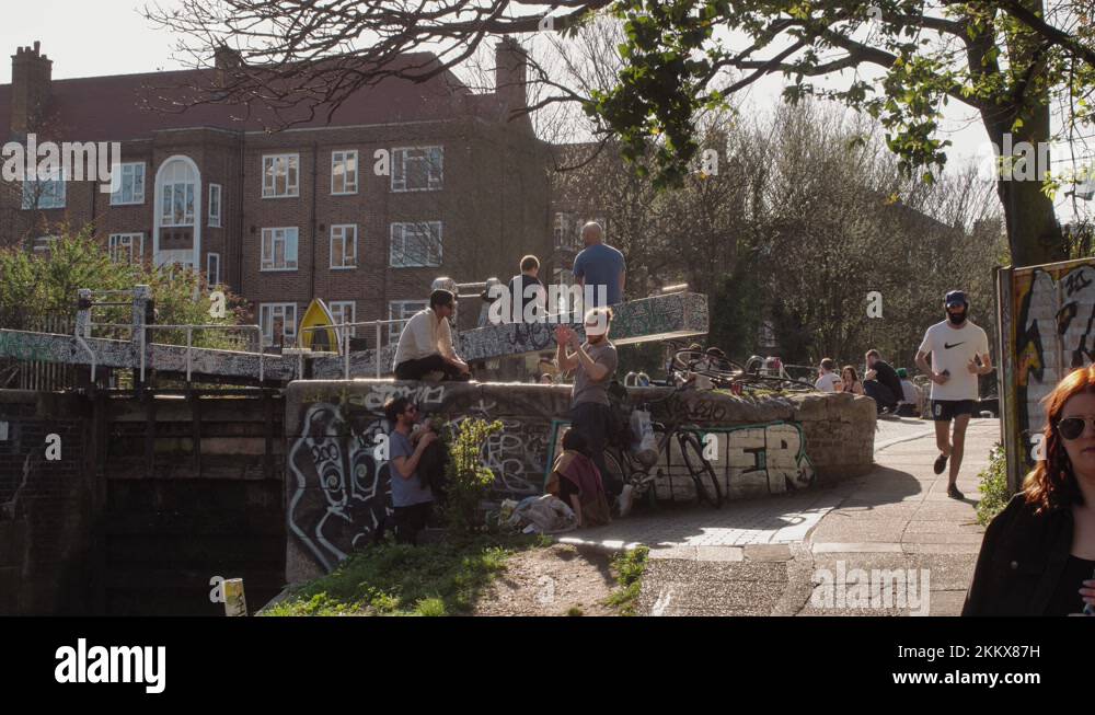 London canal docks people chilling in the sun Stock Video Footage - Alamy