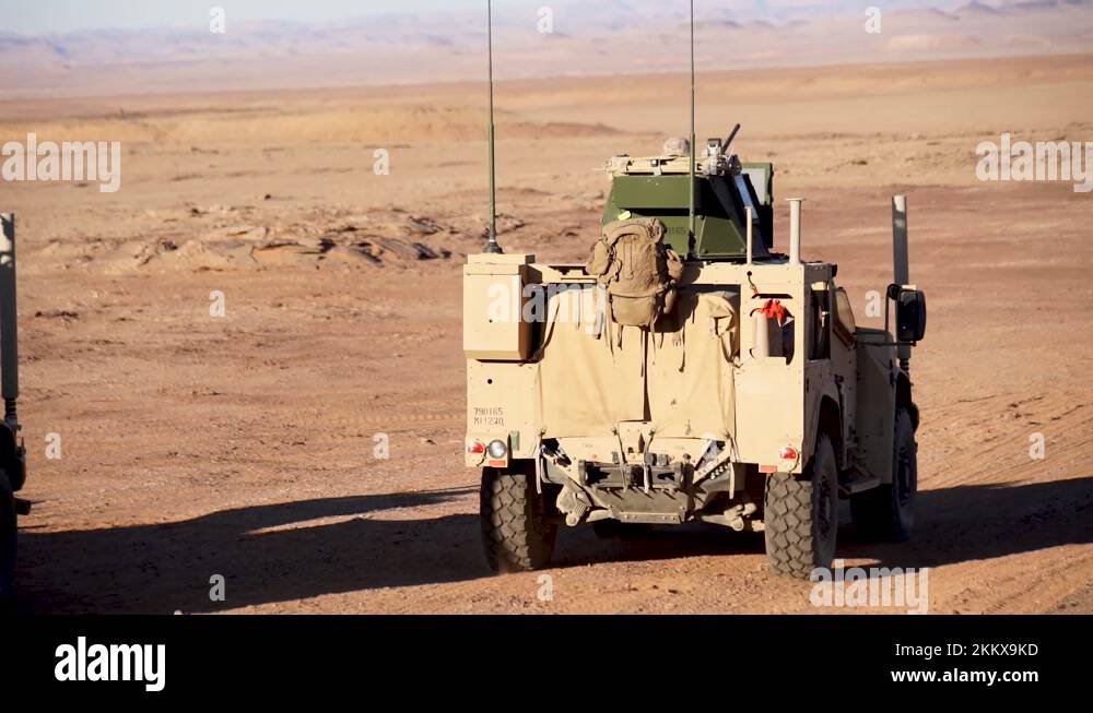 U.S. Marines driving joint light tactical vehicles in desert in Saudi ...