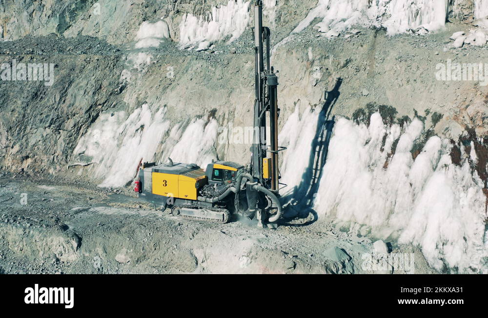 Boring machine is working in the open-cast mine. Mining industry ...