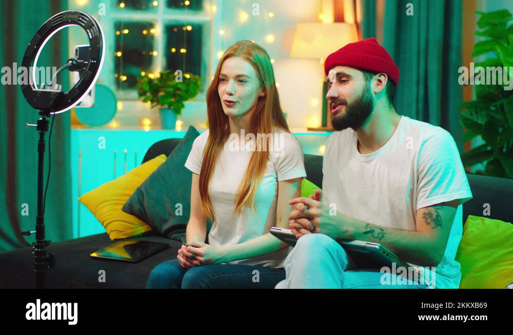 Young enthusiastic couple doing a live stream for all social media ...