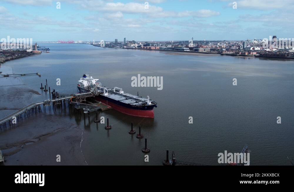 Crude oil tanker ship loading at refinery harbour terminal aerial view ...