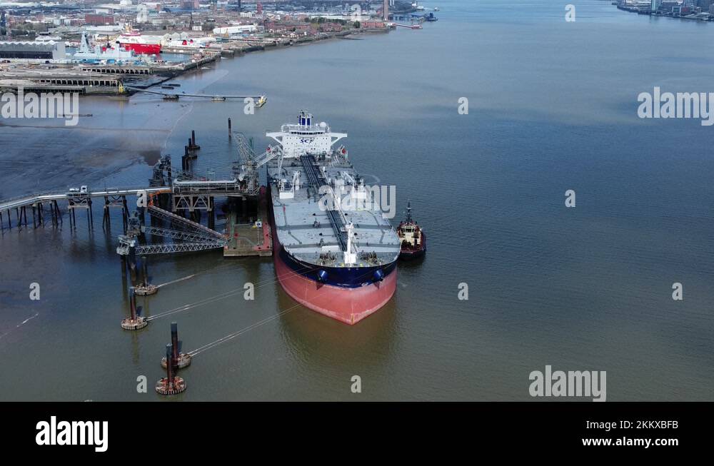 Crude oil tanker ship loading at refinery harbour terminal aerial view ...