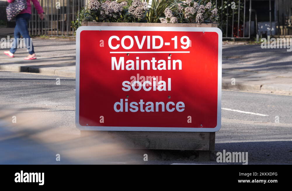 Covid 19 maintain social distance pavement sign Stock Videos & Footage ...