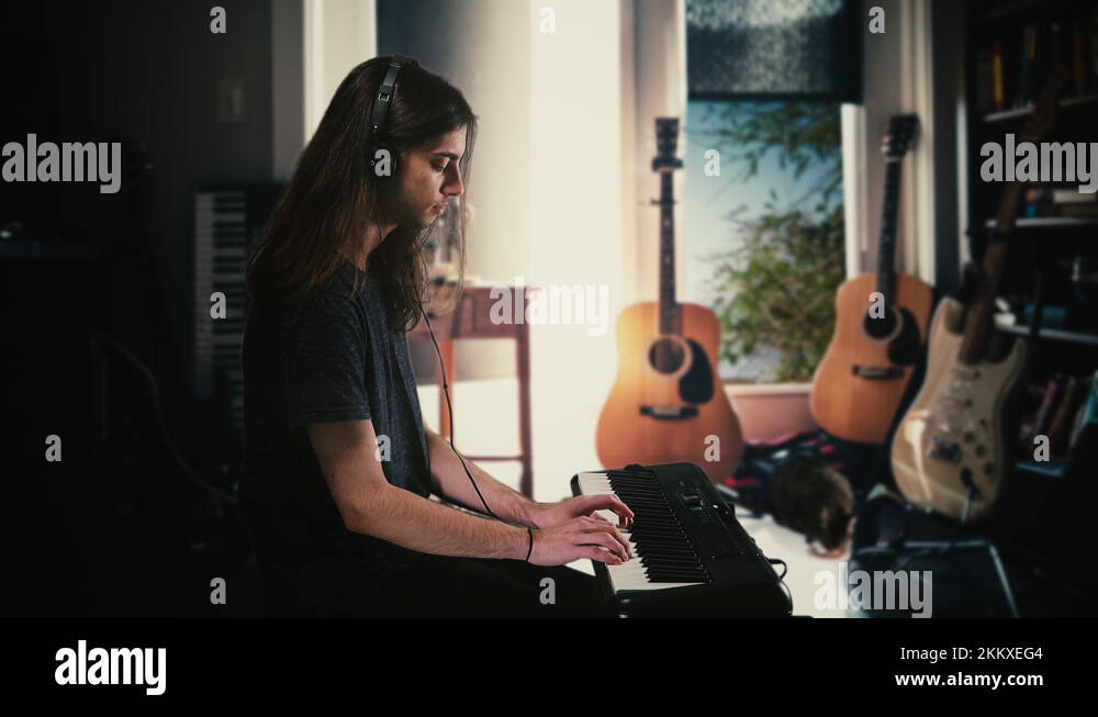 Young Musician Playing Keyboard In Home Studio Stock Video Footage - Alamy