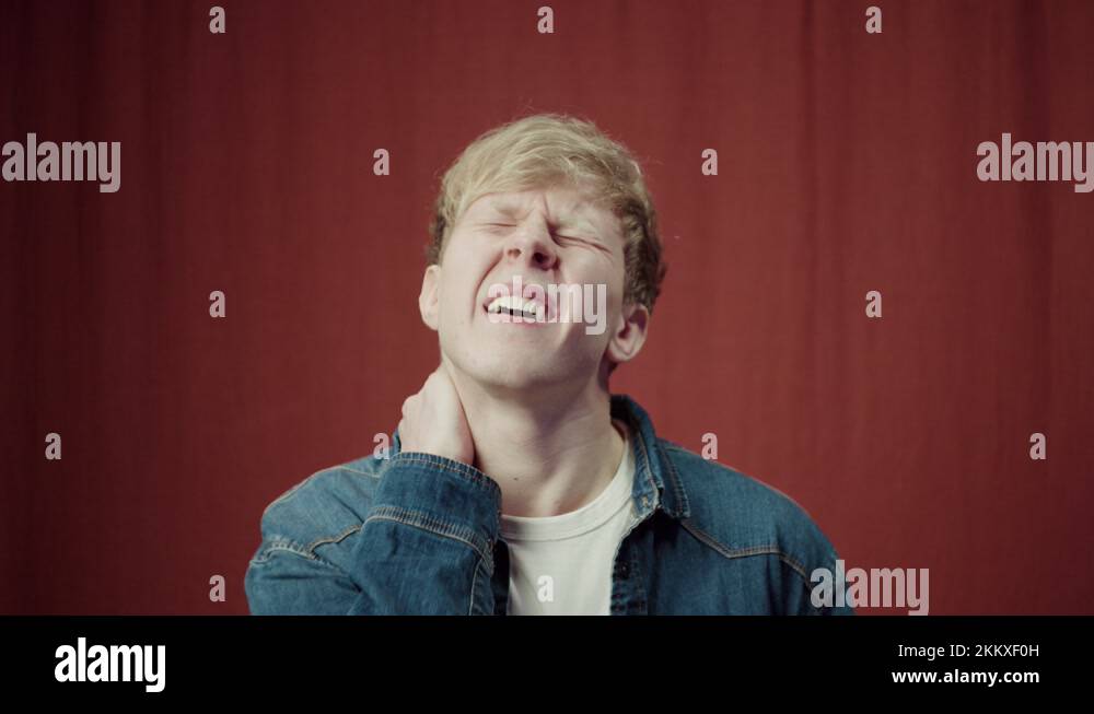 Man rubbing his neck Stock Videos & Footage - HD and 4K Video Clips - Alamy