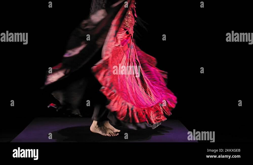 A barefoot gypsy woman without a face with long black hair in a red ...