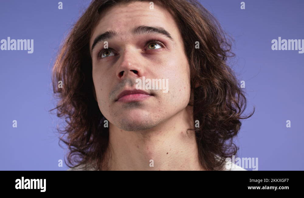 Serious man showing yes sign, nods her head approvingly. Guy with long ...