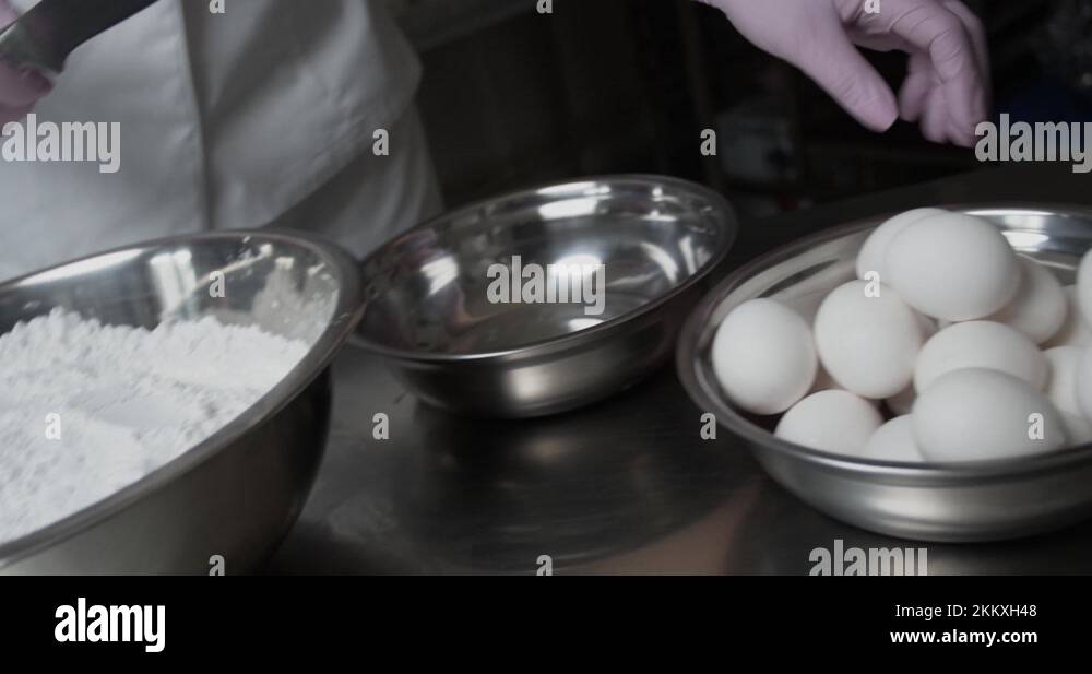 Cooking dough, cracking eggs into flour, bakery, confectionery, 4k ...