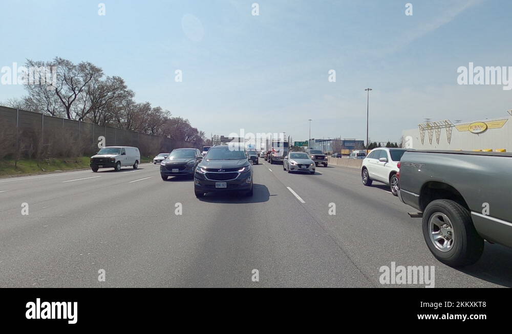 POV reverse shot driving platre on highway with truck and car traffic ...