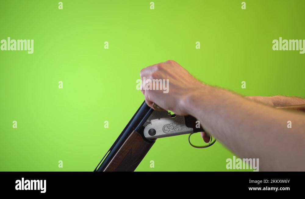 Loading a double barrel shotgun with shells on green screen Stock Video ...