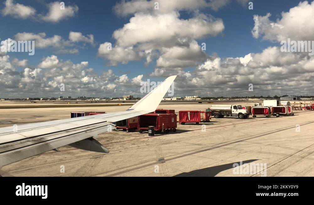 Airplane window view before taking off from Miami International Airport ...