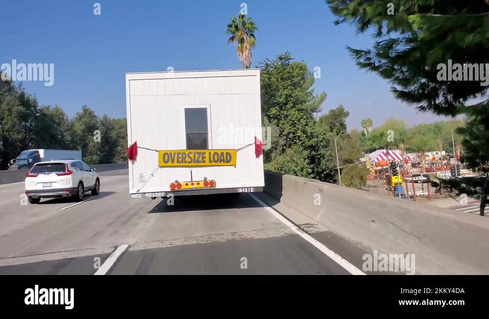 Oversize Load manufactured home on freeway being transported slow and ...
