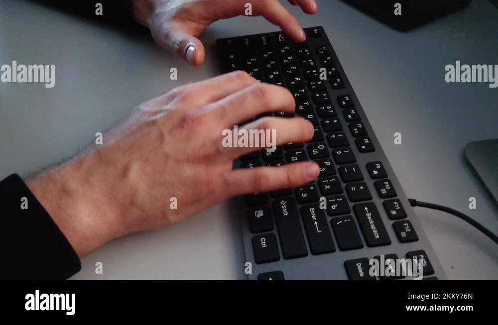 a person types on a keyboard with two hands Stock Video Footage - Alamy