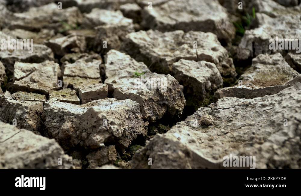 Arid and cracked land by the river, natural disaster Stock Video ...