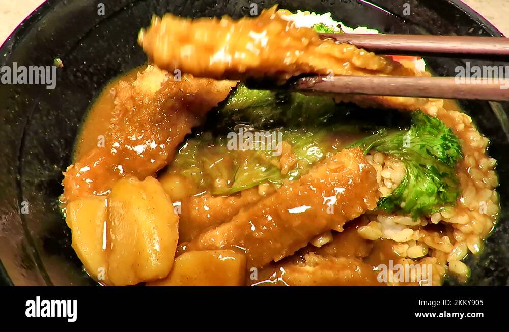 Katsu curry a popular Japanese curry base dish. Eating it with ...