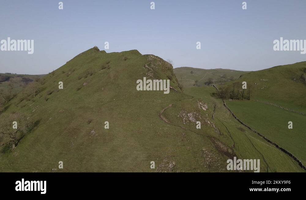 4K drone footage of a big, green, beautiful hill in the Peak District ...