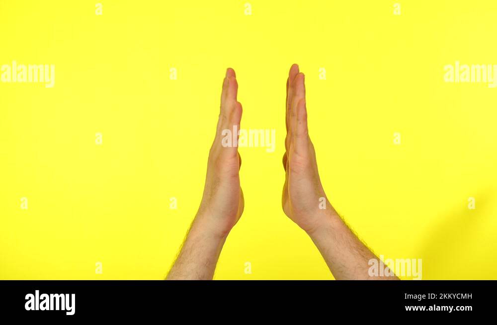 Man hands clapping applause gesture isolated over yellow background in ...