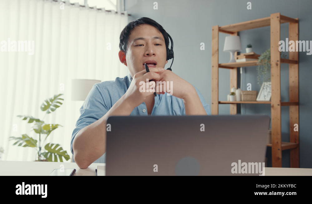 Asia businessman using computer laptop talk to colleagues in video call ...