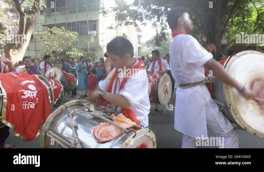 Indian kid playing with indian instruments dhol tasha on streets of ...
