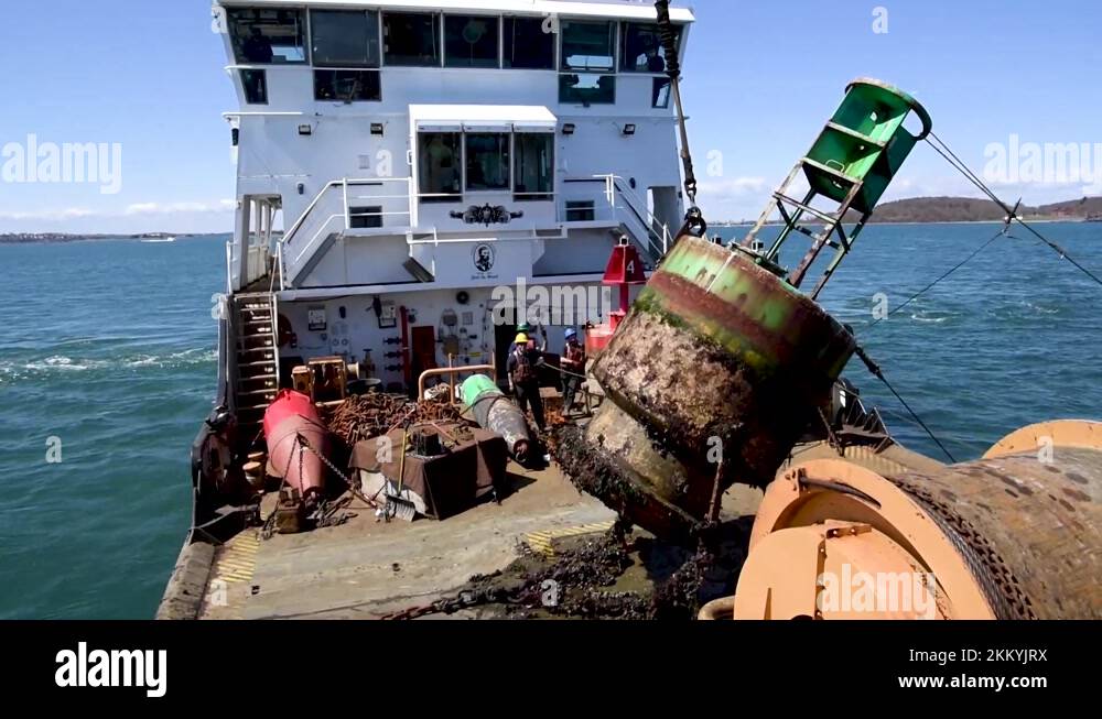 U.S. Coast Guard lifting buoy off deck of Cutter Marcus Hanna Stock ...