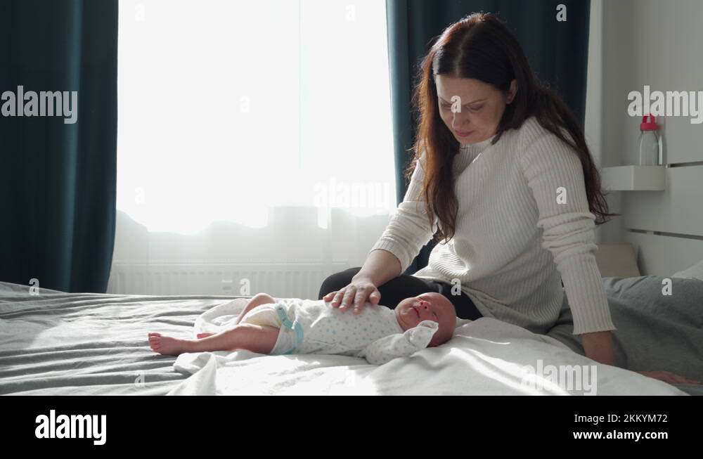 Baby touch mother bed Stock Videos & Footage - HD and 4K Video Clips ...