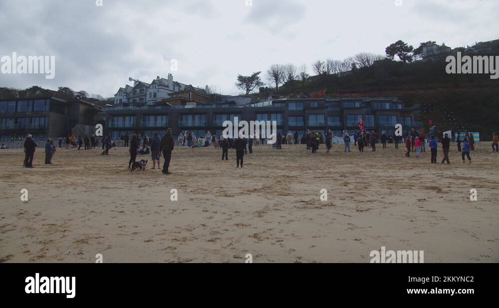 Random people protesting on the beach in front of the Carbis Bay Hotel ...